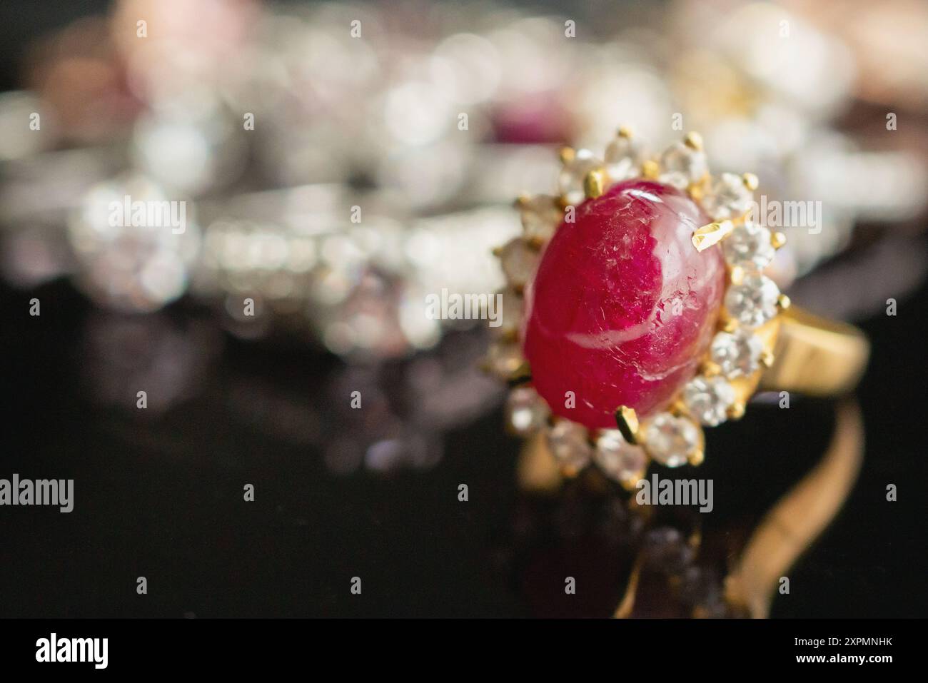 Jewelry red ruby diamond rings on black background with reflection ...