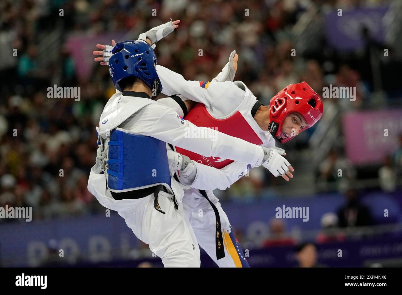Korea's Taejoon Park, left, competes with Venezuela's Yohandri Granado ...