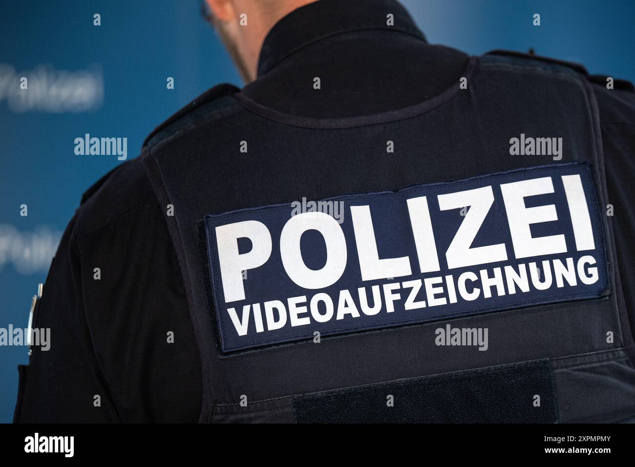 07 August 2024, Thuringia, Erfurt: A police officer wears a patch with ...