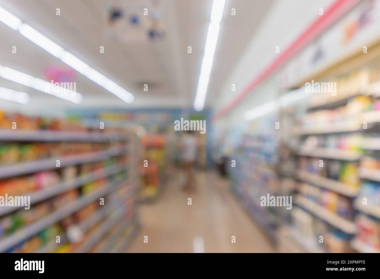 Supermarket convenience store aisle interior shelves blur background ...
