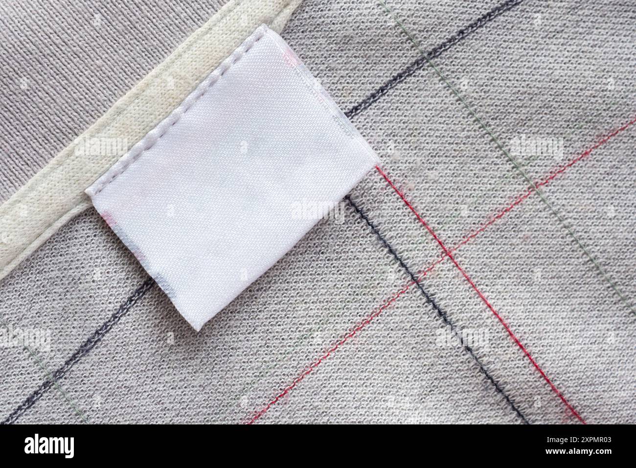 laundry care clothing label on fabric texture Stock Photo - Alamy
