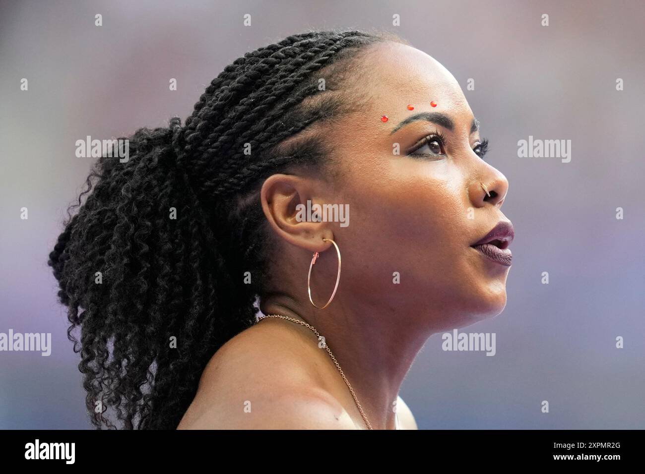 Ebony Morrison, of Liberia, reacts after women's 100-meter hurdles heat at the 2024 Summer ...