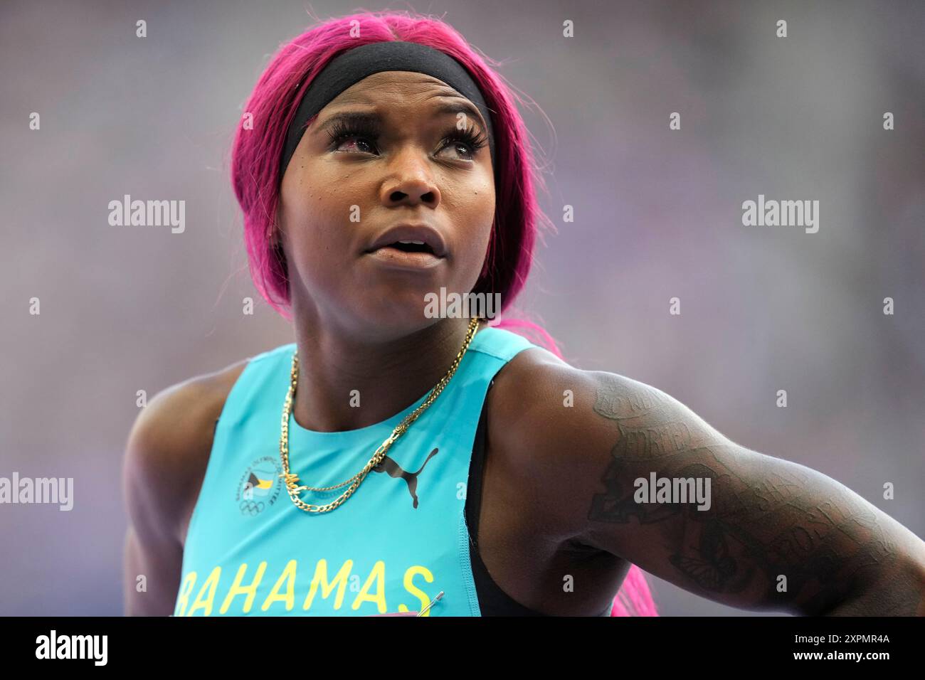 Denisha Cartwright, of Bahamas, reacts after her women's 100-meter ...