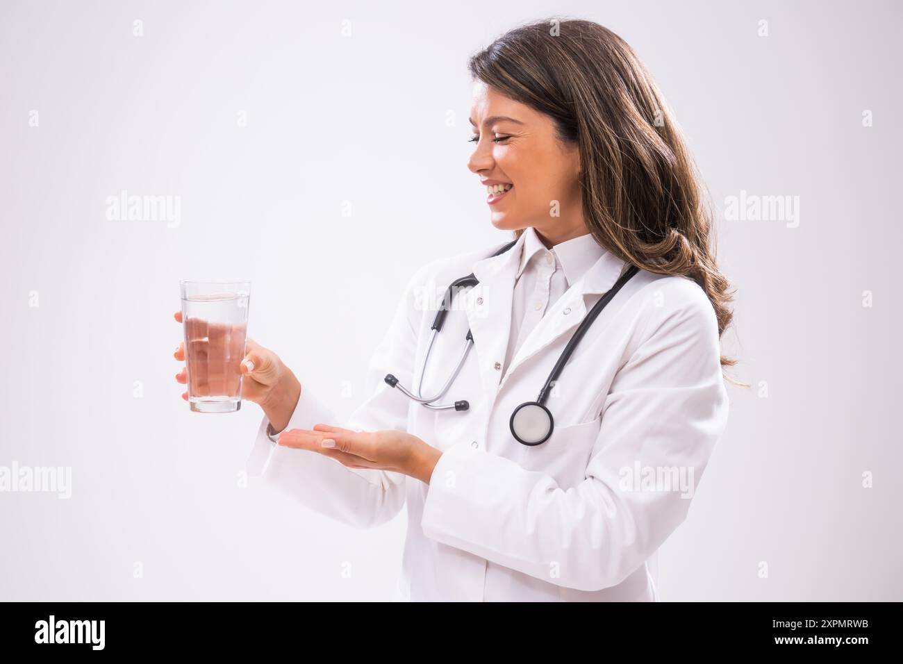 Female doctor drinking water hi-res stock photography and images - Alamy