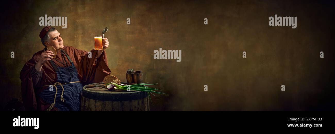 Medieval man, monk degustation beer, ale with bread and onion ...