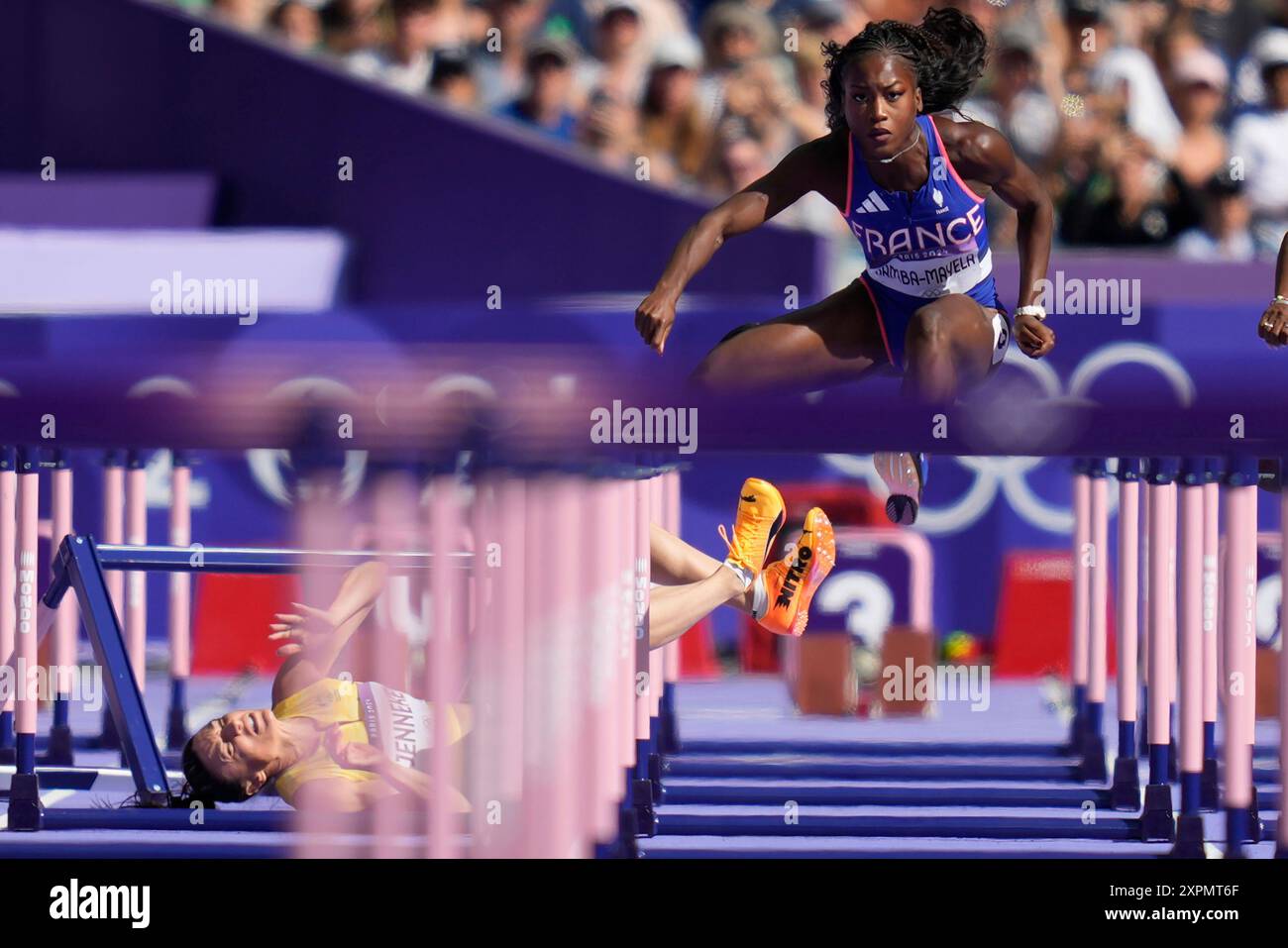 Michelle Jenneke, of Australia, falls as Cyrena Samba-Mayela, of France ...