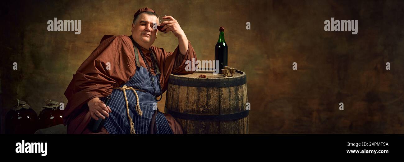 Hangover. Medieval man, monk in traditional attire leaning glass with ...