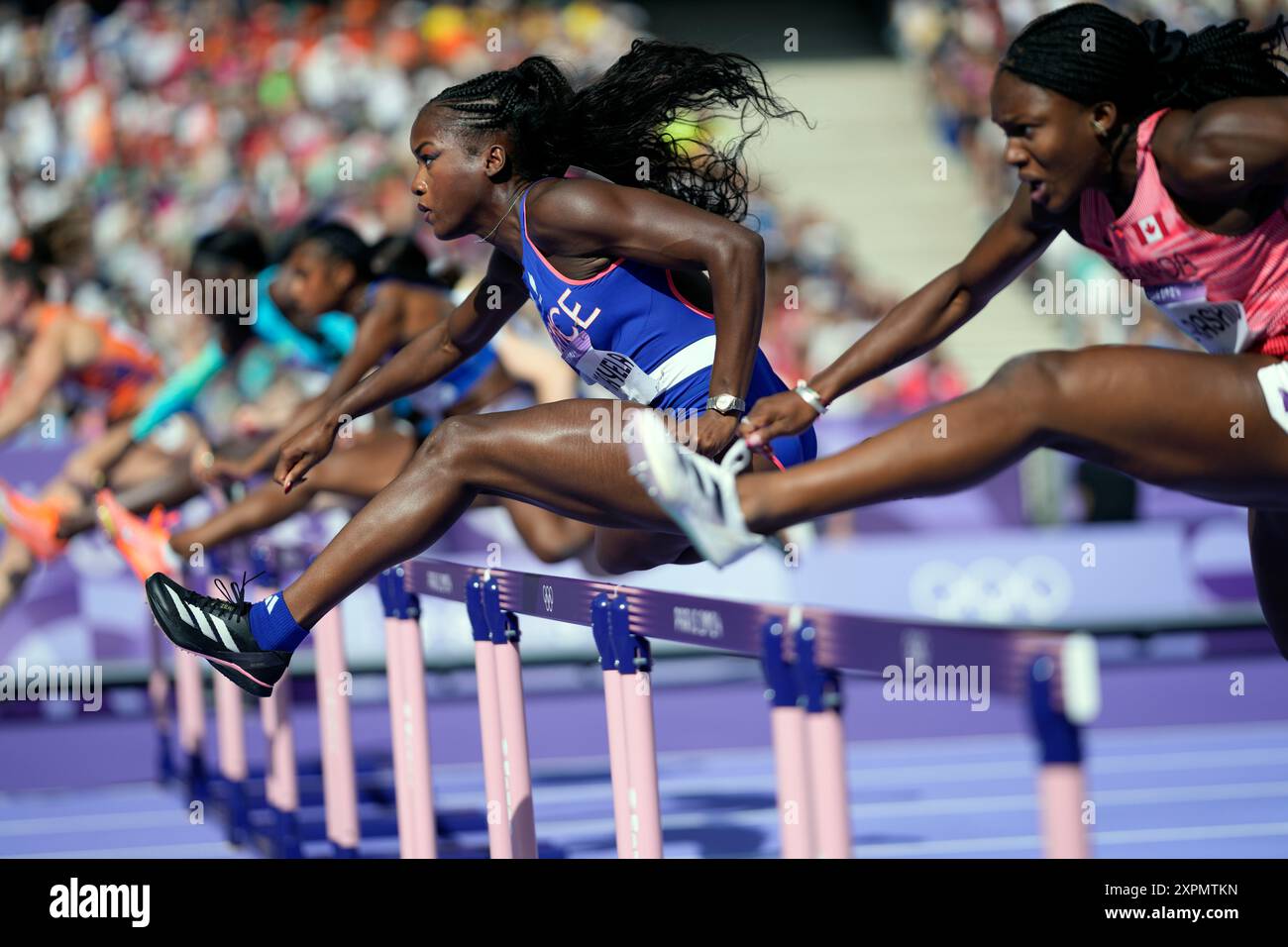 Cyrena Samba-Mayela, of France, competes during a heat in the women's ...