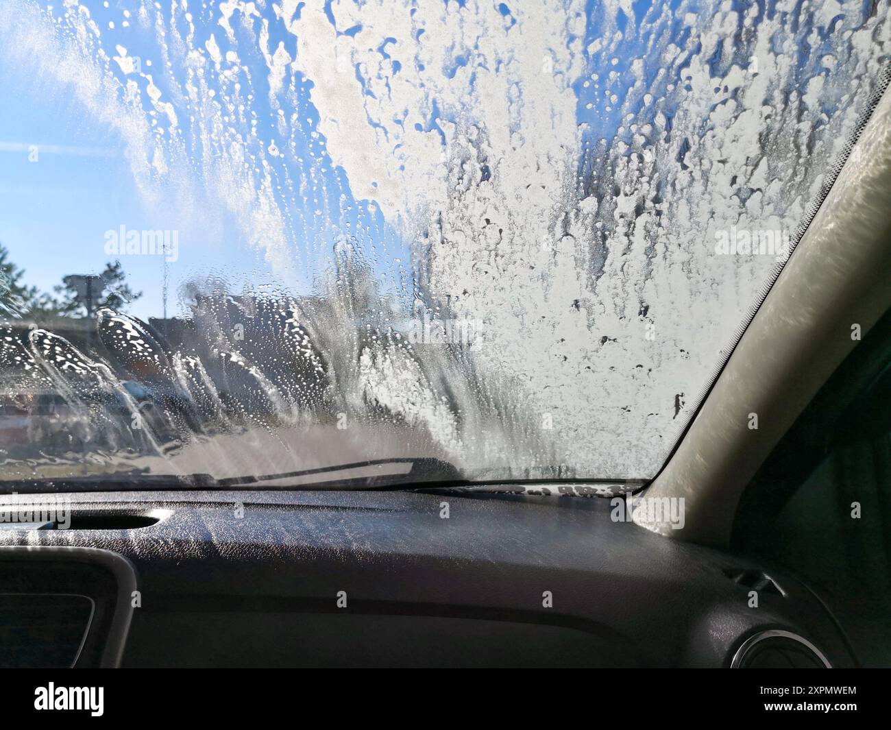 Car wash foam on a windshield, view from inside car. Auto Wash. Washing ...