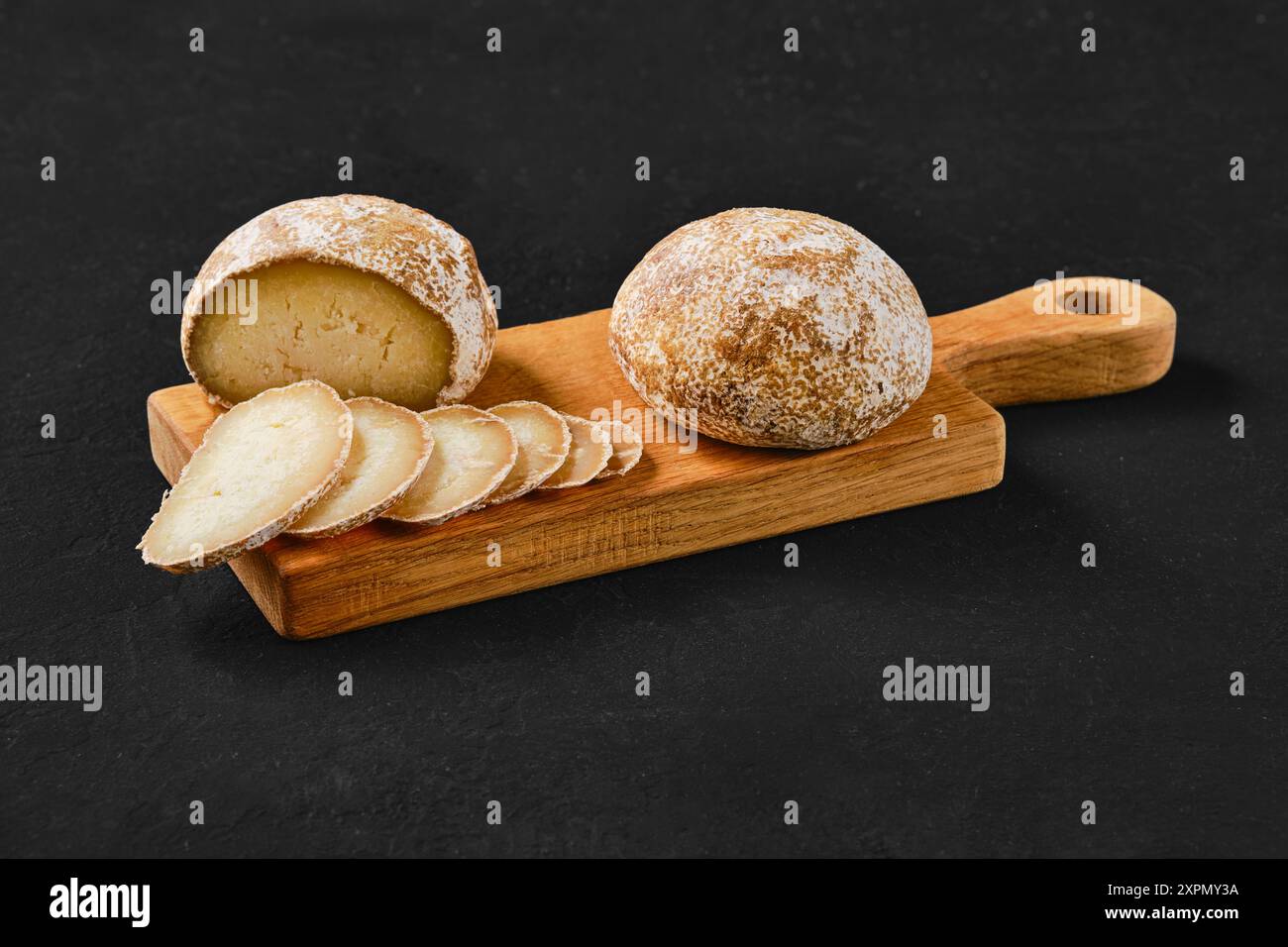 Traditional whole and sliced homemade Georgian cheese Dambalkhacho on ...