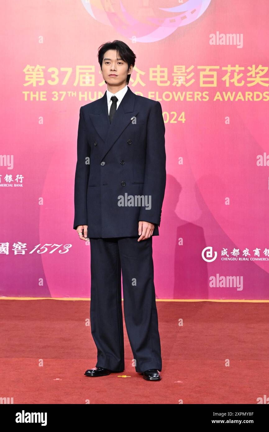 Chinese actor, singer, and host Wei Daxun poses on red carpet of the ...