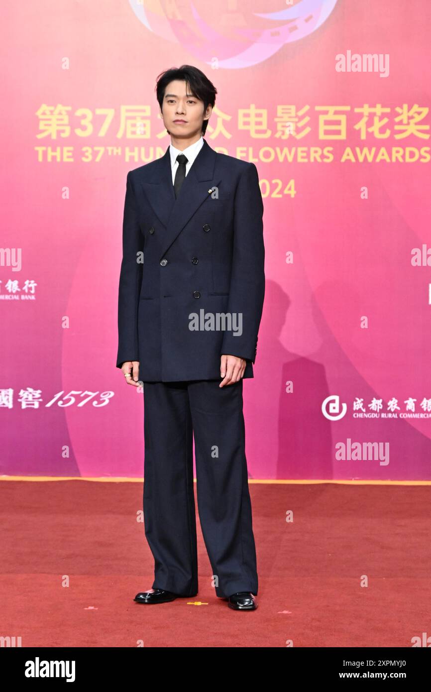 Chinese actor, singer, and host Wei Daxun poses on red carpet of the ...