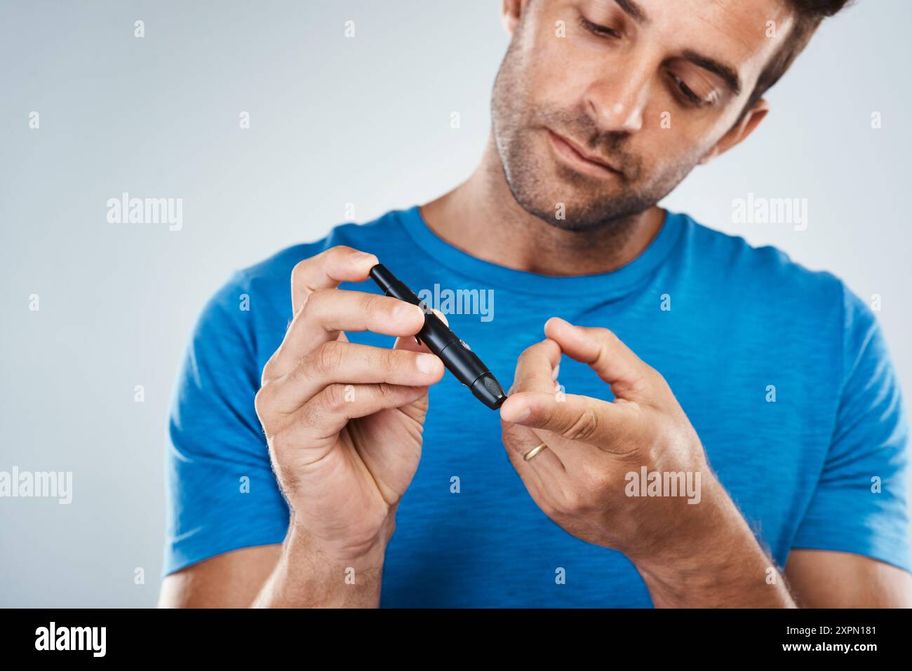 Man, finger and check blood for diabetes with healthcare, wellness and ...