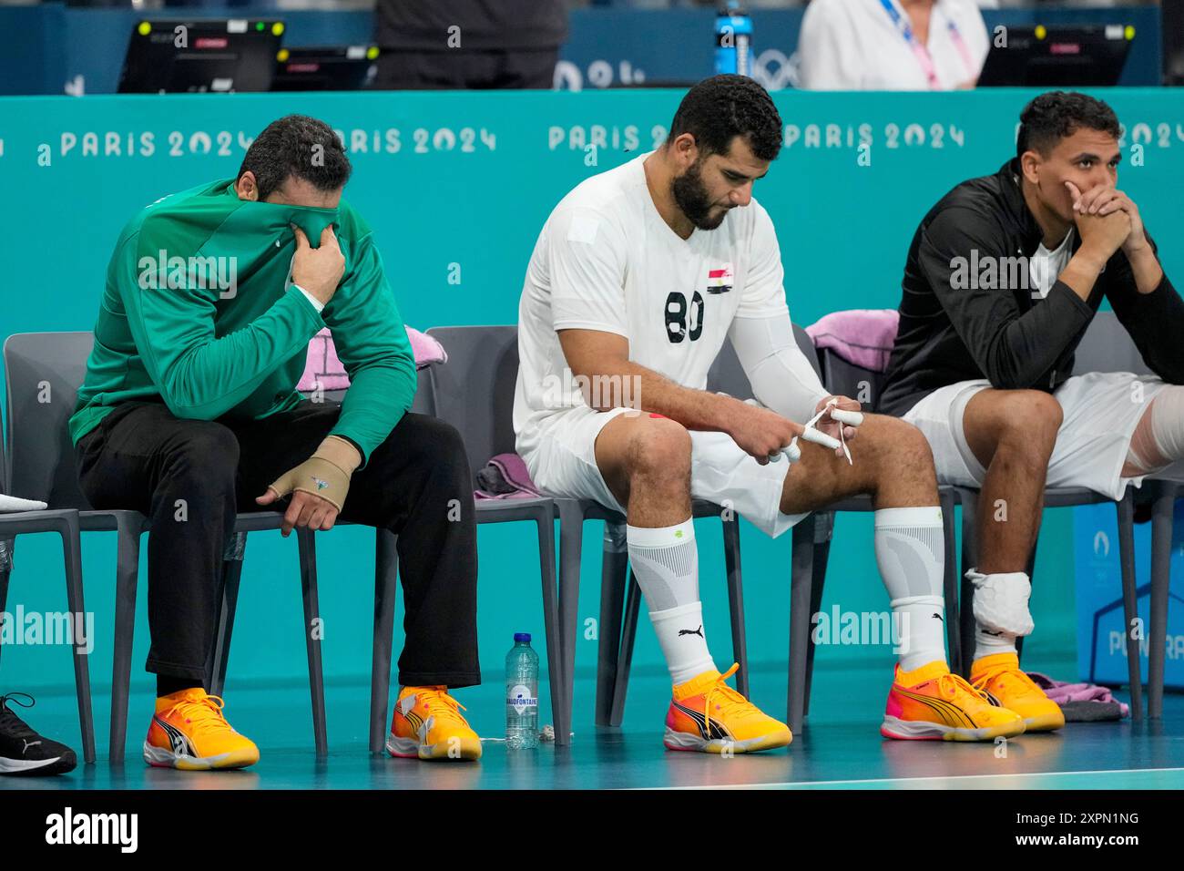 Egypt's Ahmed Adel, center, and Egypt goalkeeper Mohamed Aly, left, are ...