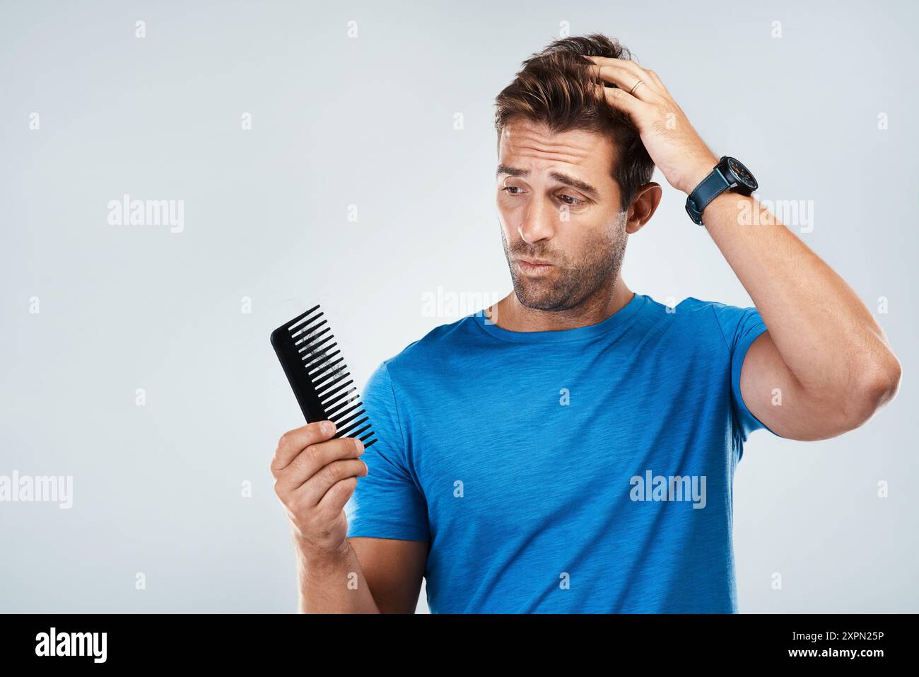 Man, comb and stress for hair loss in studio with crisis, genetic ...