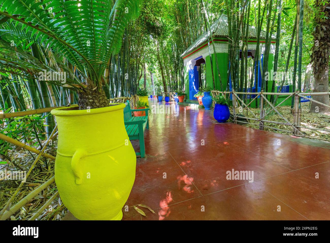 Alignment of multi-colored pots in the paths of the Majorelle garden in ...