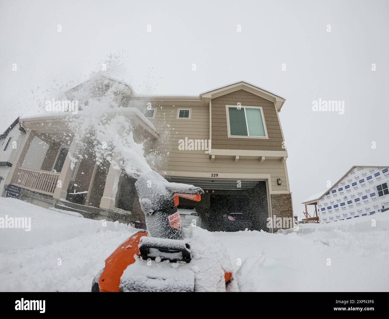 Winter's Embrace with a Snow-Covered Neighborhood Scene Stock Photo - Alamy