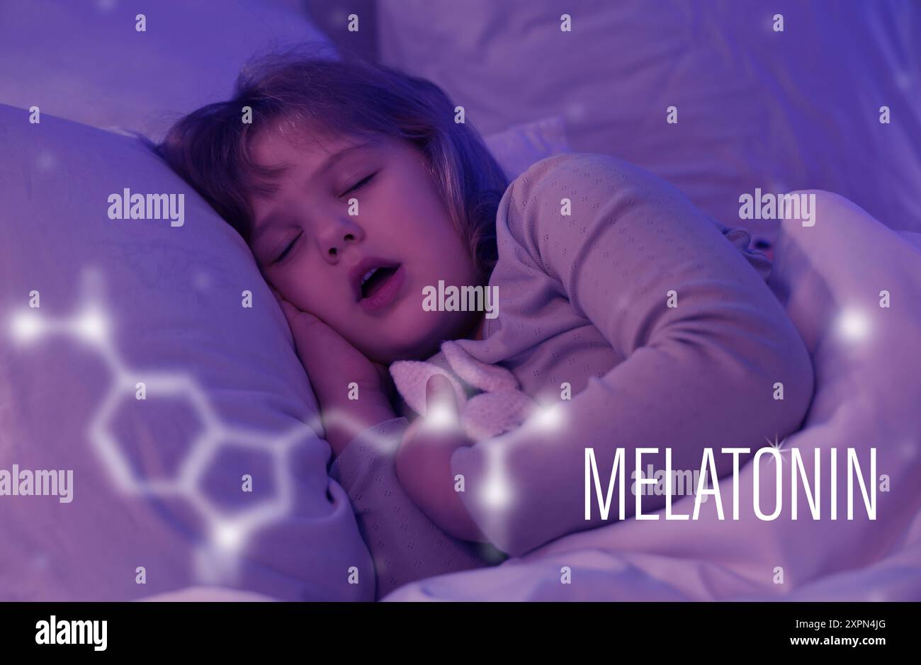 Cute little girl sleeping in bed at night. Melatonin concept Stock ...
