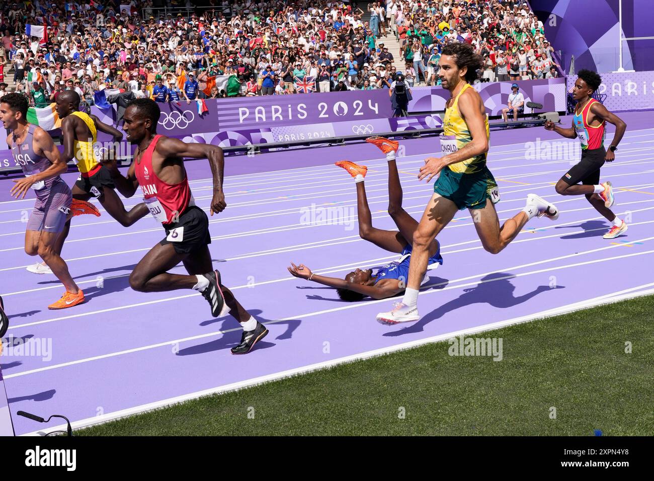 Abdihamid Nur, of the United States, falls during a heat in the men's ...