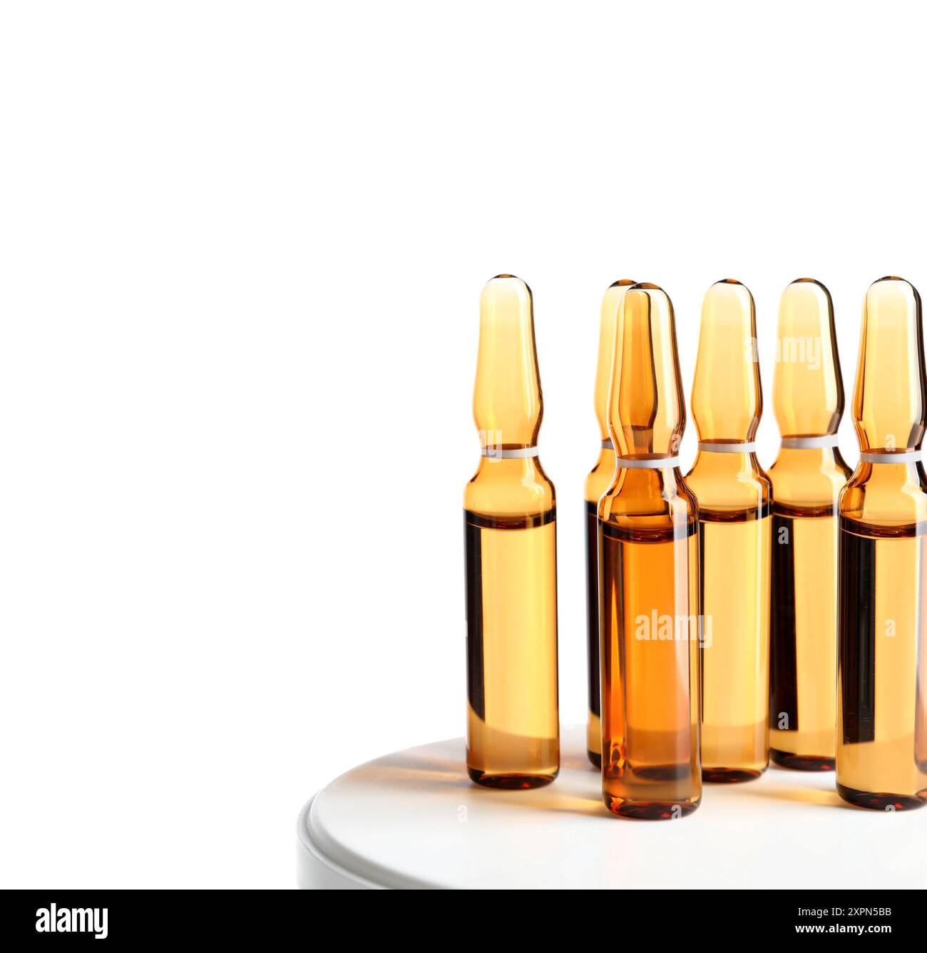 Many ampules on white background Stock Photo - Alamy