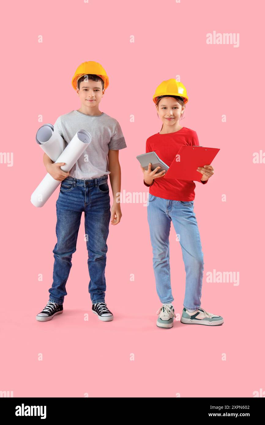 Little architects with house plans and calculator on pink background ...
