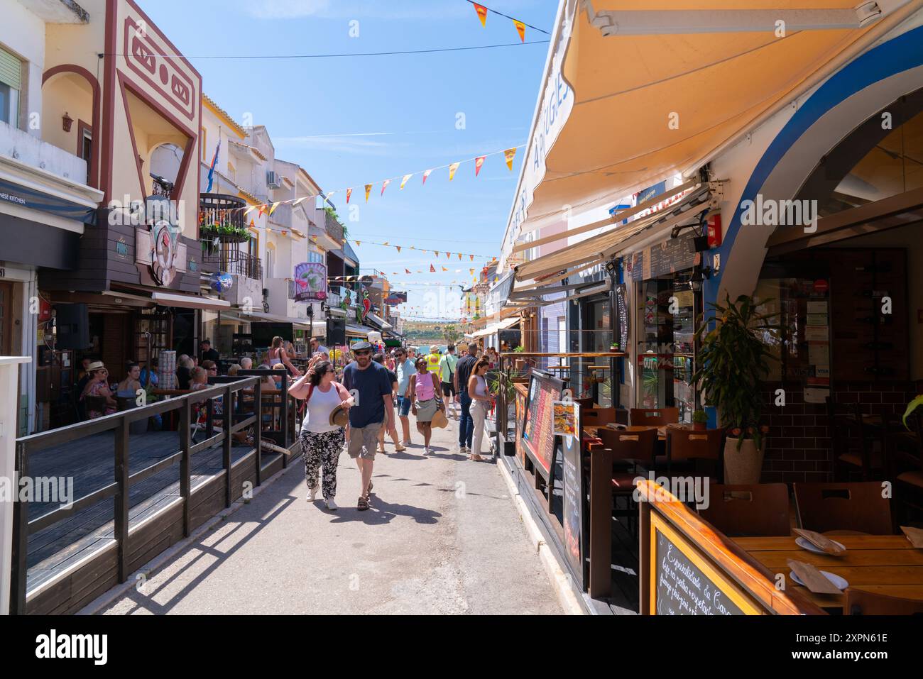 Alvor Portugal busy street in Algarve town with tourists and visitors ...
