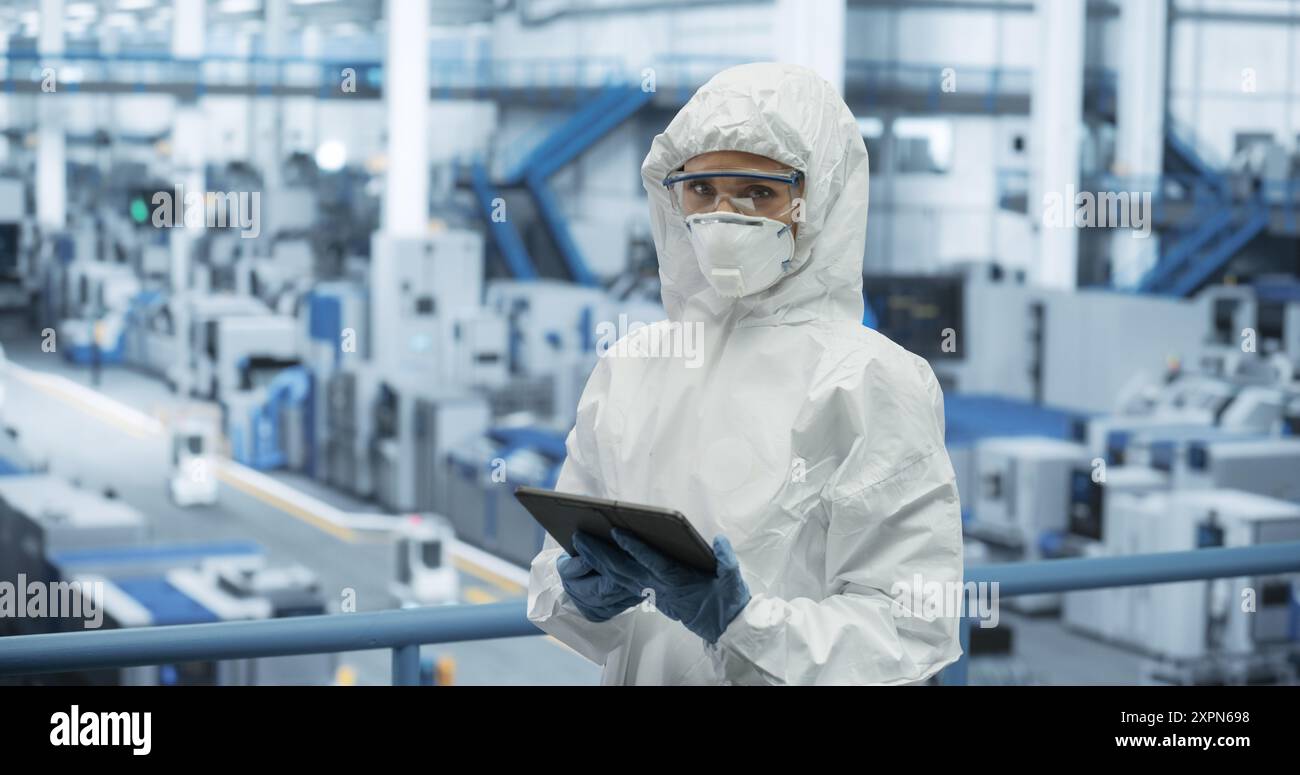 Female Worker Wearing Full-Body Protective Coveralls, Mask and Goggles ...