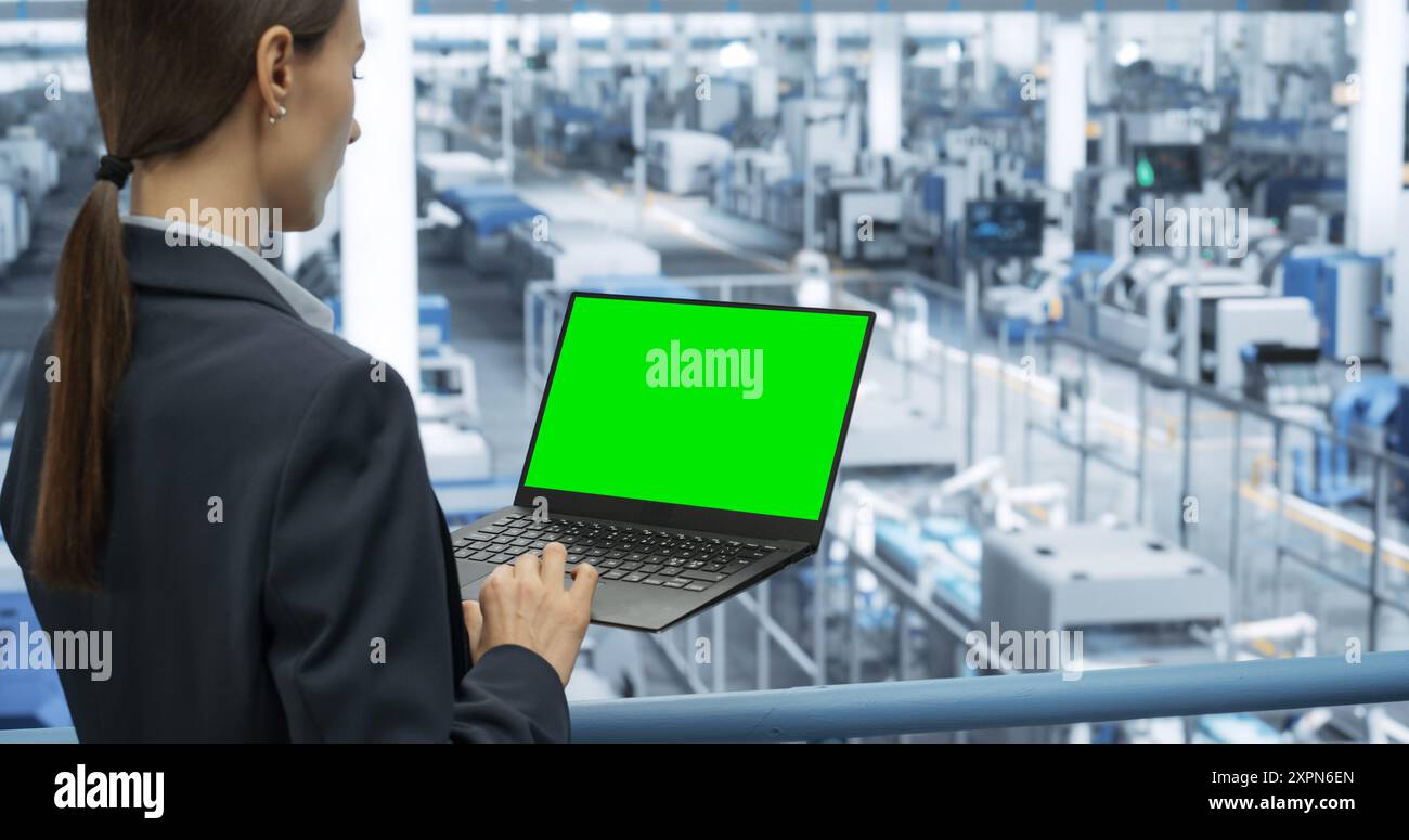 Young Female Engineer Using Laptop Computer with Green Screen Mock Up ...