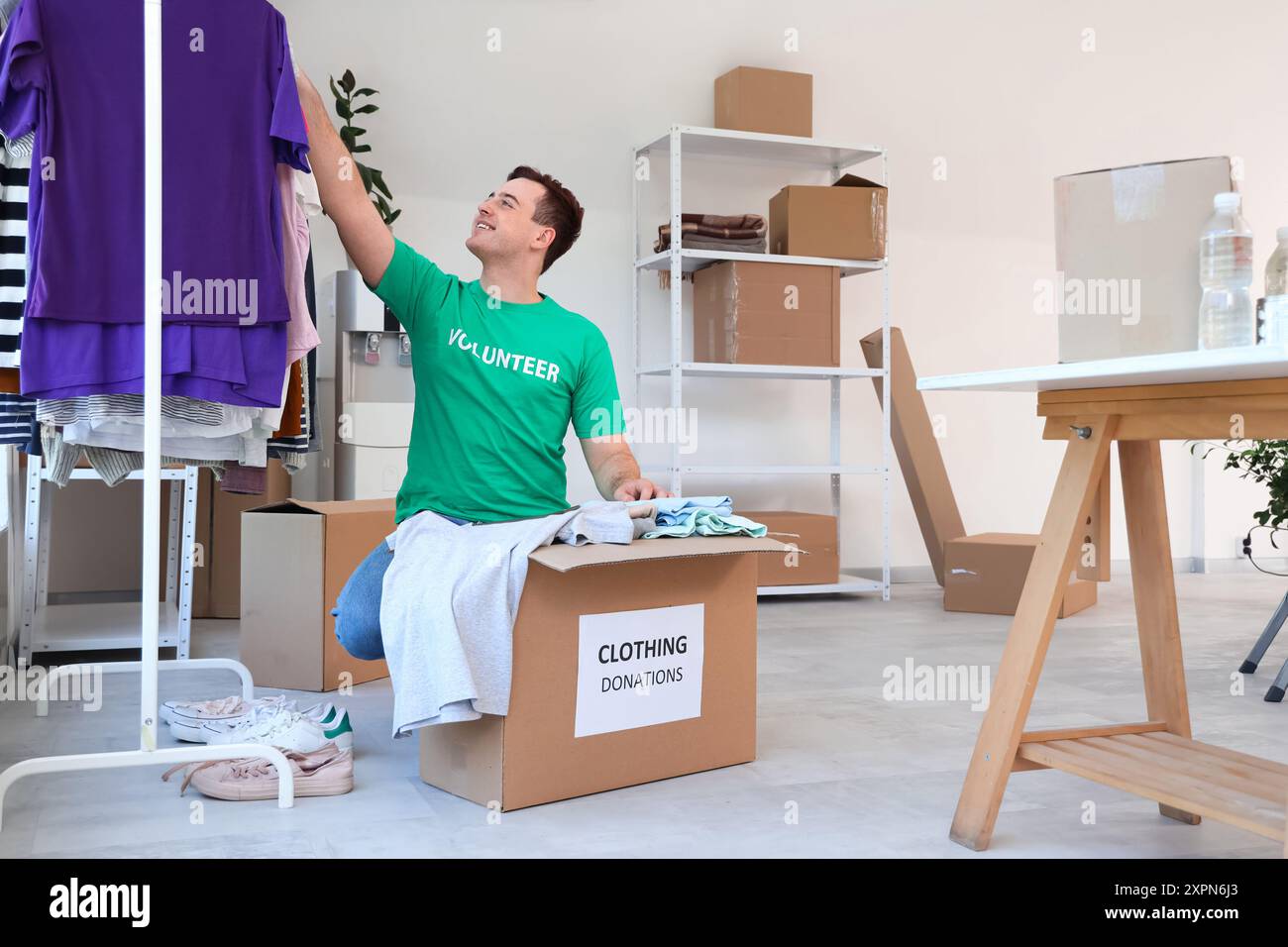 Person donating goods hi-res stock photography and images - Alamy