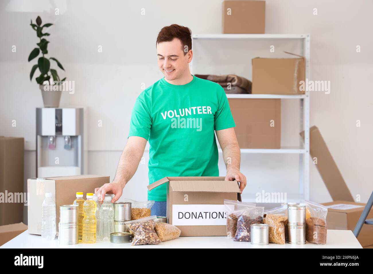 Person donating goods hi-res stock photography and images - Alamy