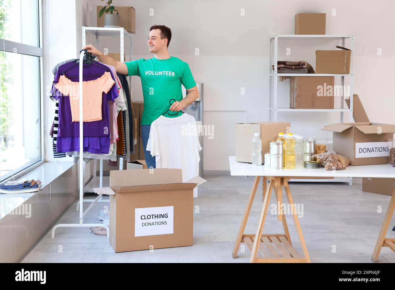 Person donating goods hi-res stock photography and images - Alamy