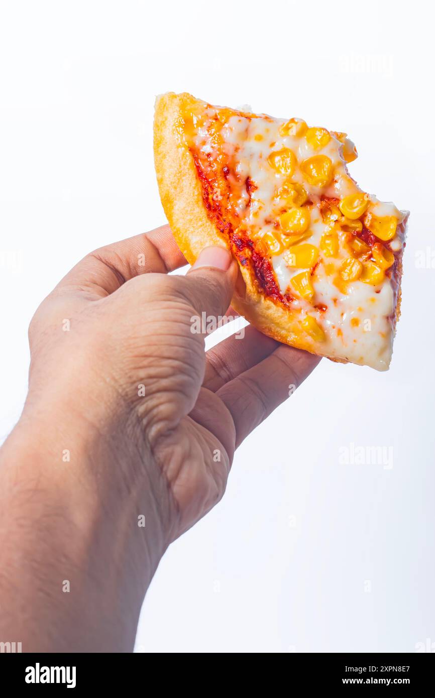 Human hand holding slice of bitten pizza on white background. fast food ...