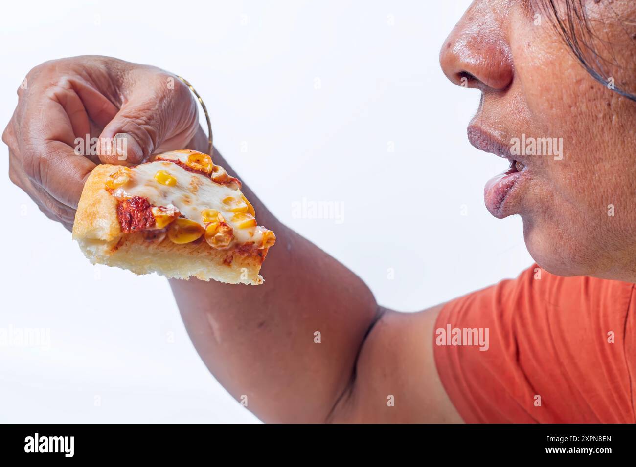 Fat woman eating a slice of pizza isolated on white background ...