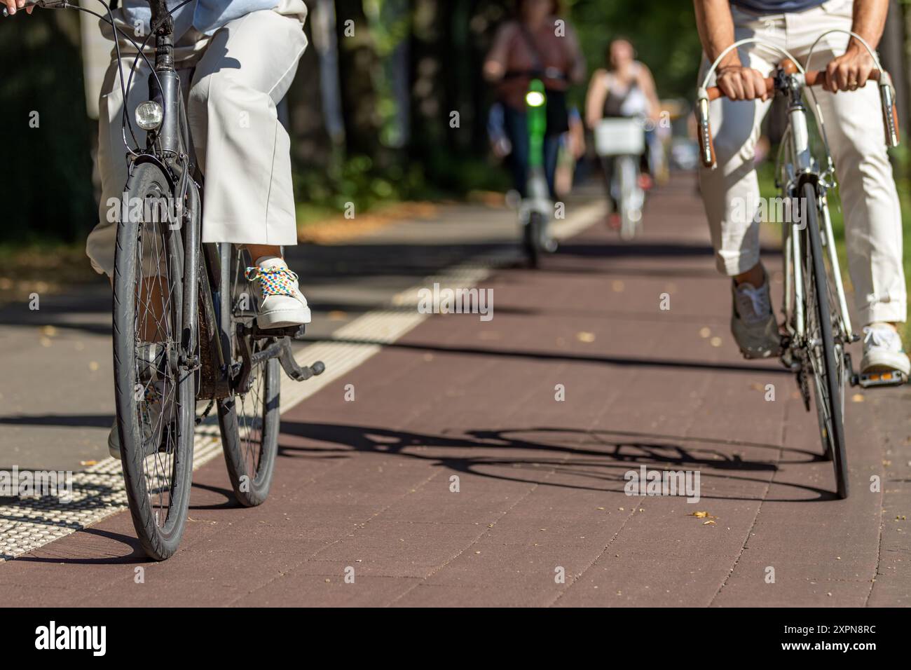 Cyclist riding on pavement hi-res stock photography and images - Alamy