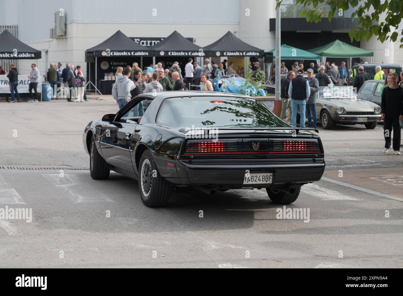 Rear view of an old classic American sports car, the black third ...
