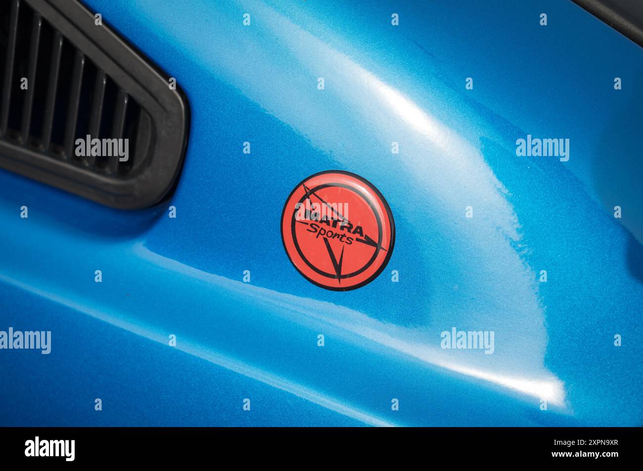 Detail of the Matra emblem on a blue Matra Murena. It is a circular red ...