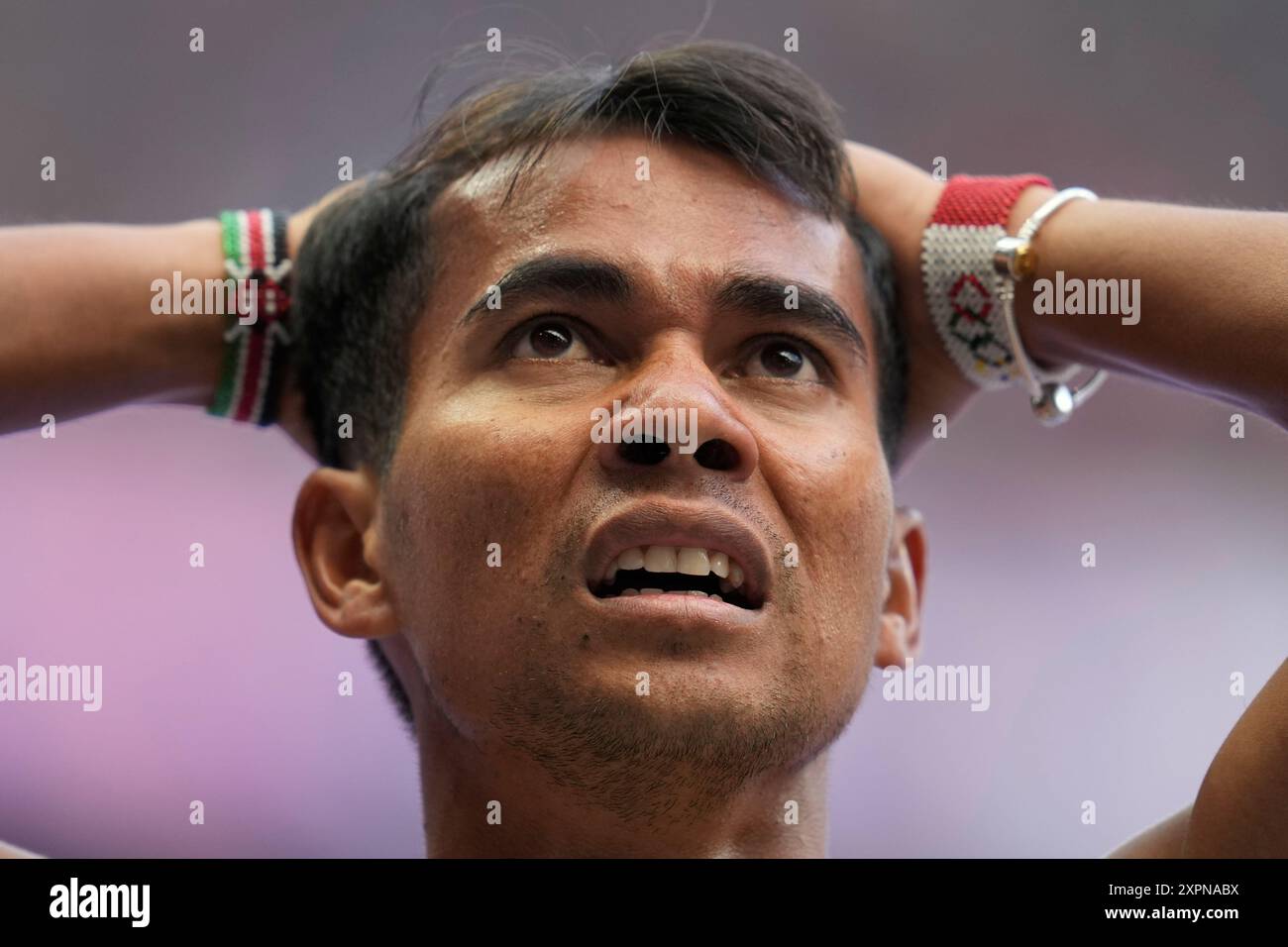 Bunthorn Chhun, of Cambodia, reacts following his men's 800-meter heat at the 2024 Summer ...
