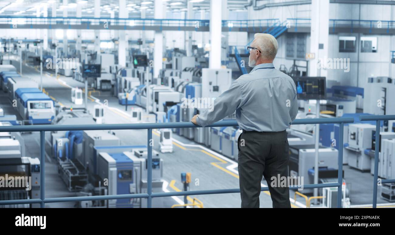 Industrial Engineer Working at a Technology Factory. Middle Aged ...