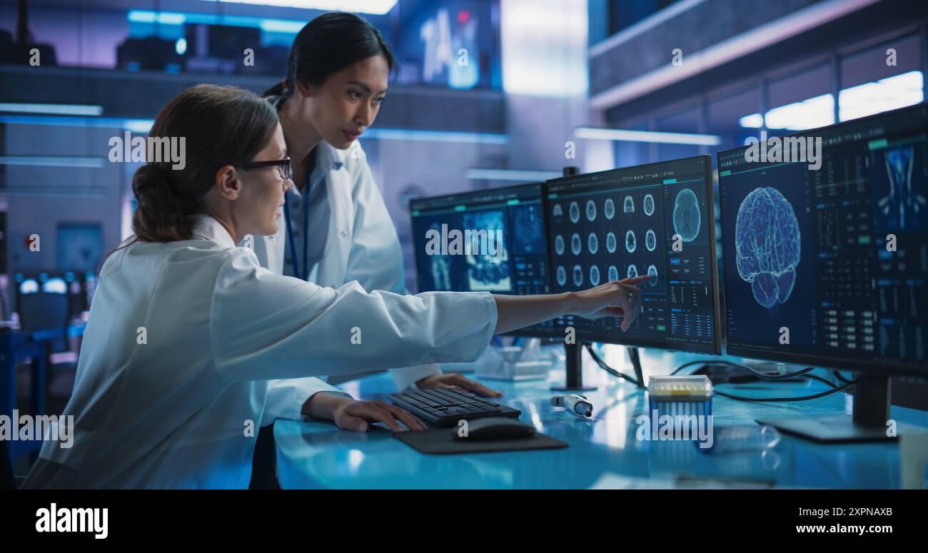 Medical Hospital Research Laboratory: Caucasian And Asian Female Scientists Talking And Using ...