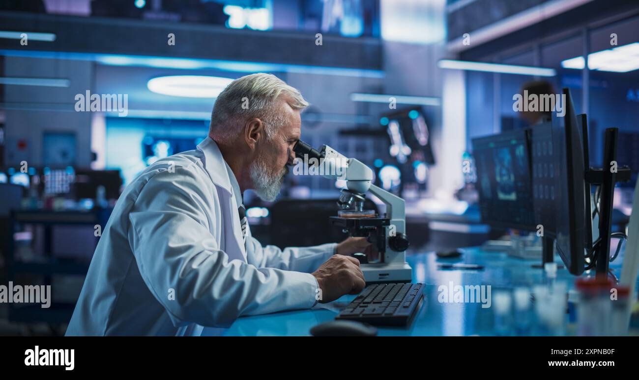 Medical Development Laboratory: Caucasian Male Scientist Using ...