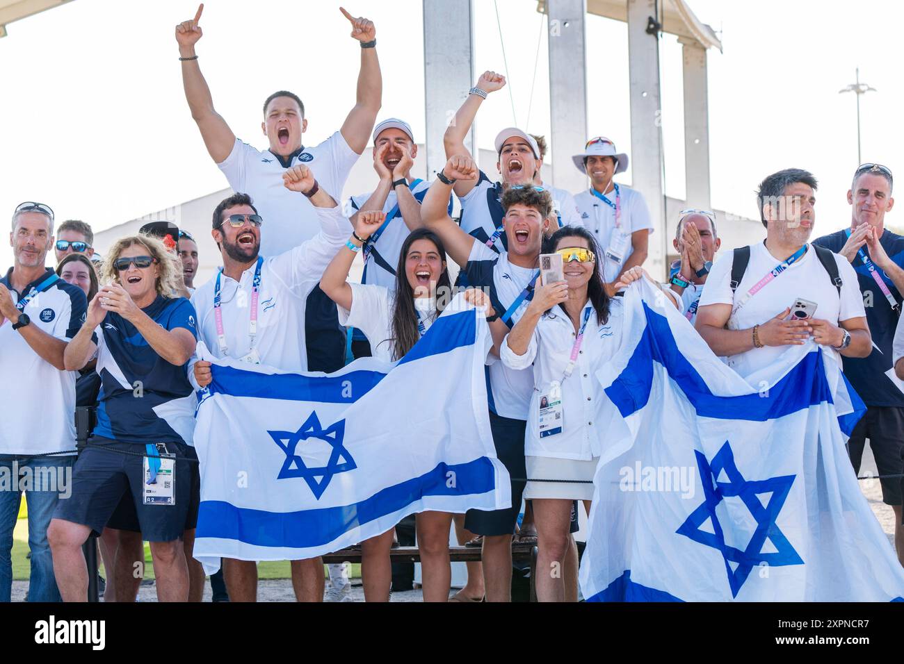 Members of team Israel cheer during the medal ceremony for Israel's Tom ...