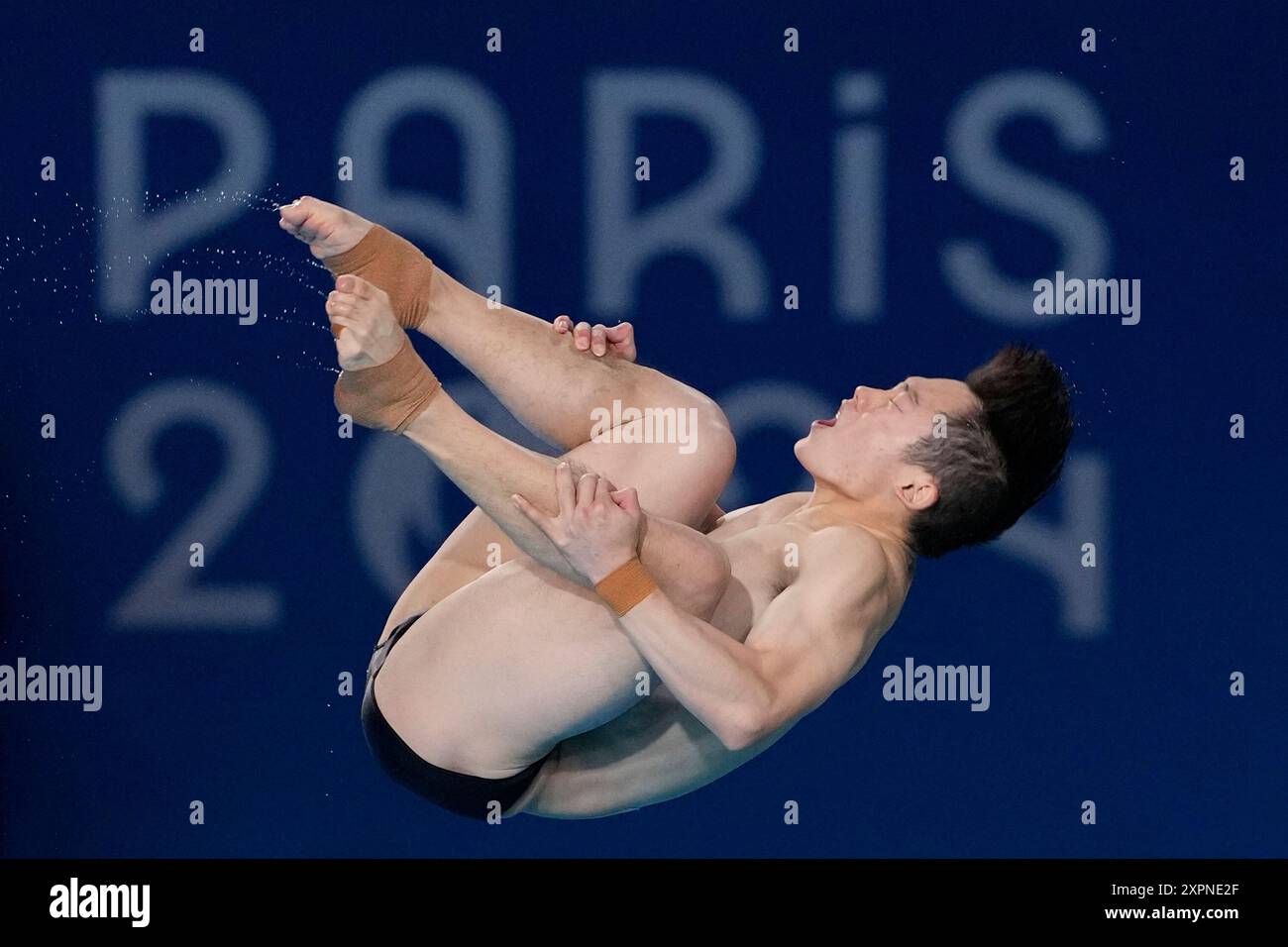 China's Wang Zongyuan competes in the men's 3m springboard diving ...