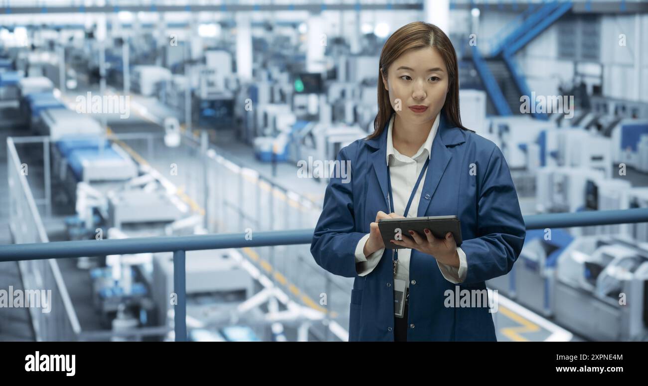 Thoughtful Asian Engineer Monitoring and Analyzing Conditions at a ...