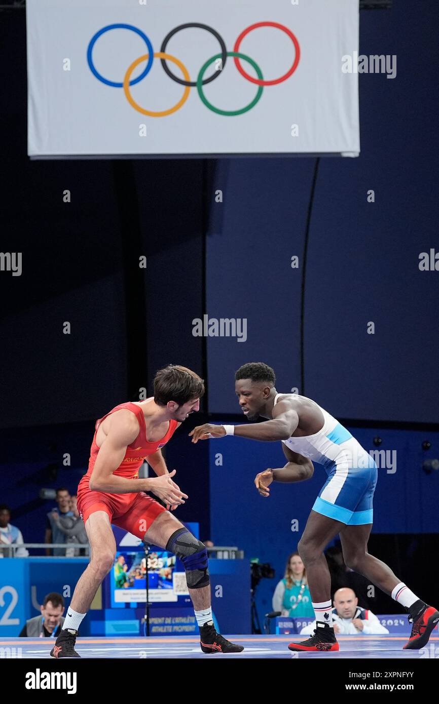 Armenia's Slavik Galstyan and France's Mamadassa Sylla, right, compete ...