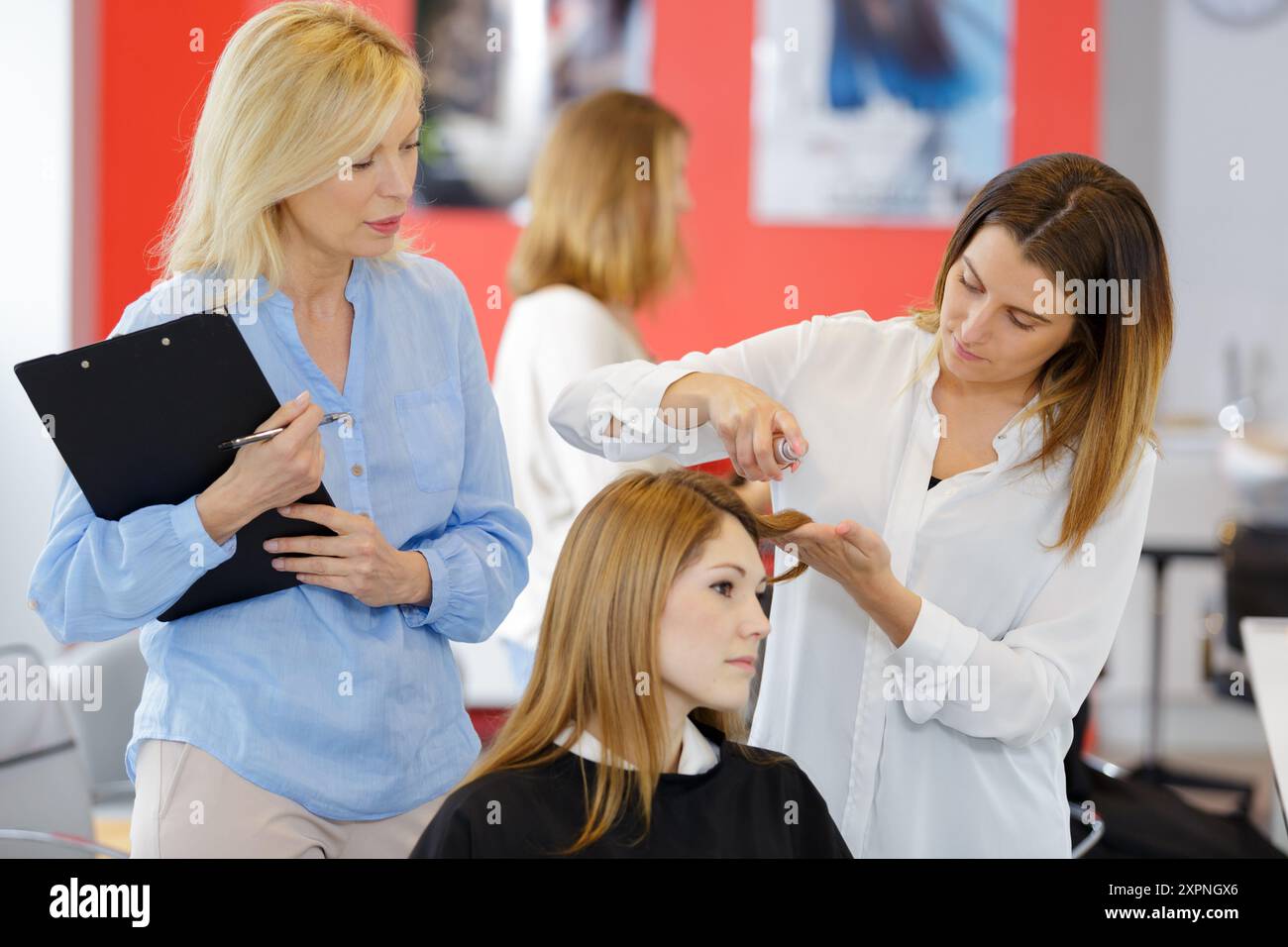 student girl in hairdressing learning how to cut hair Stock Photo - Alamy