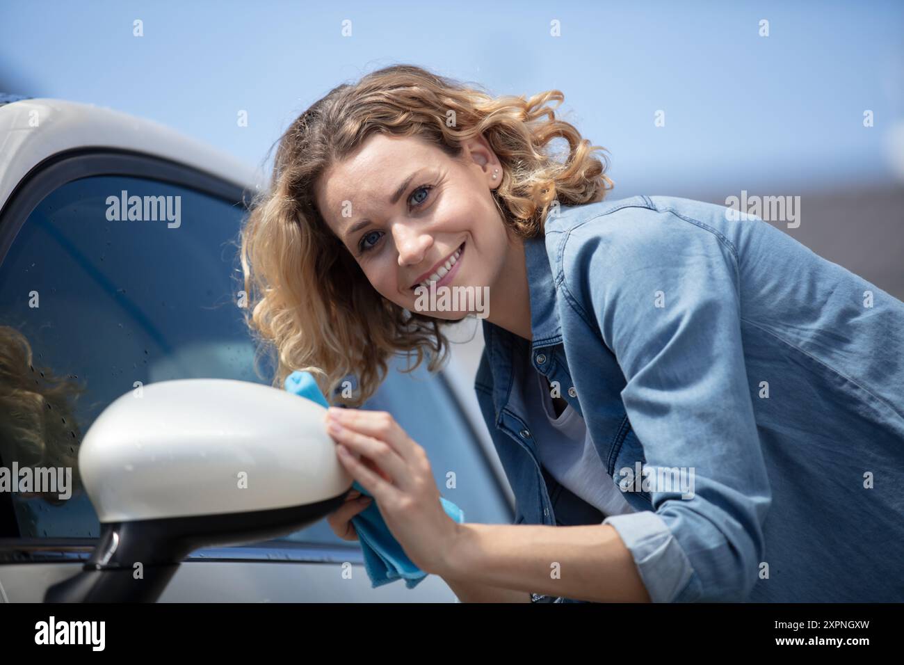 happy woman hand pulling the side mirror Stock Photo - Alamy