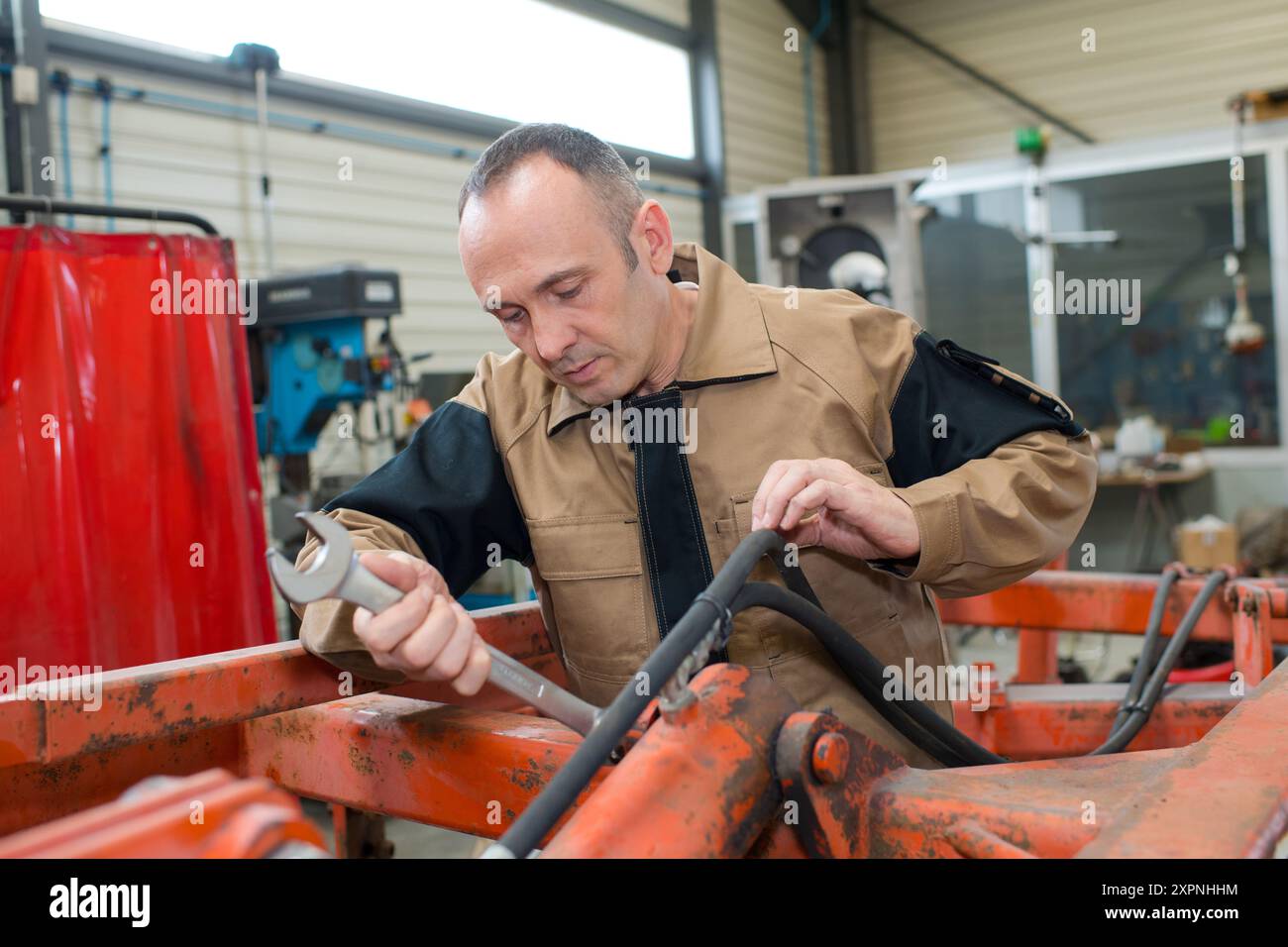 Fixing tractor hi-res stock photography and images - Alamy