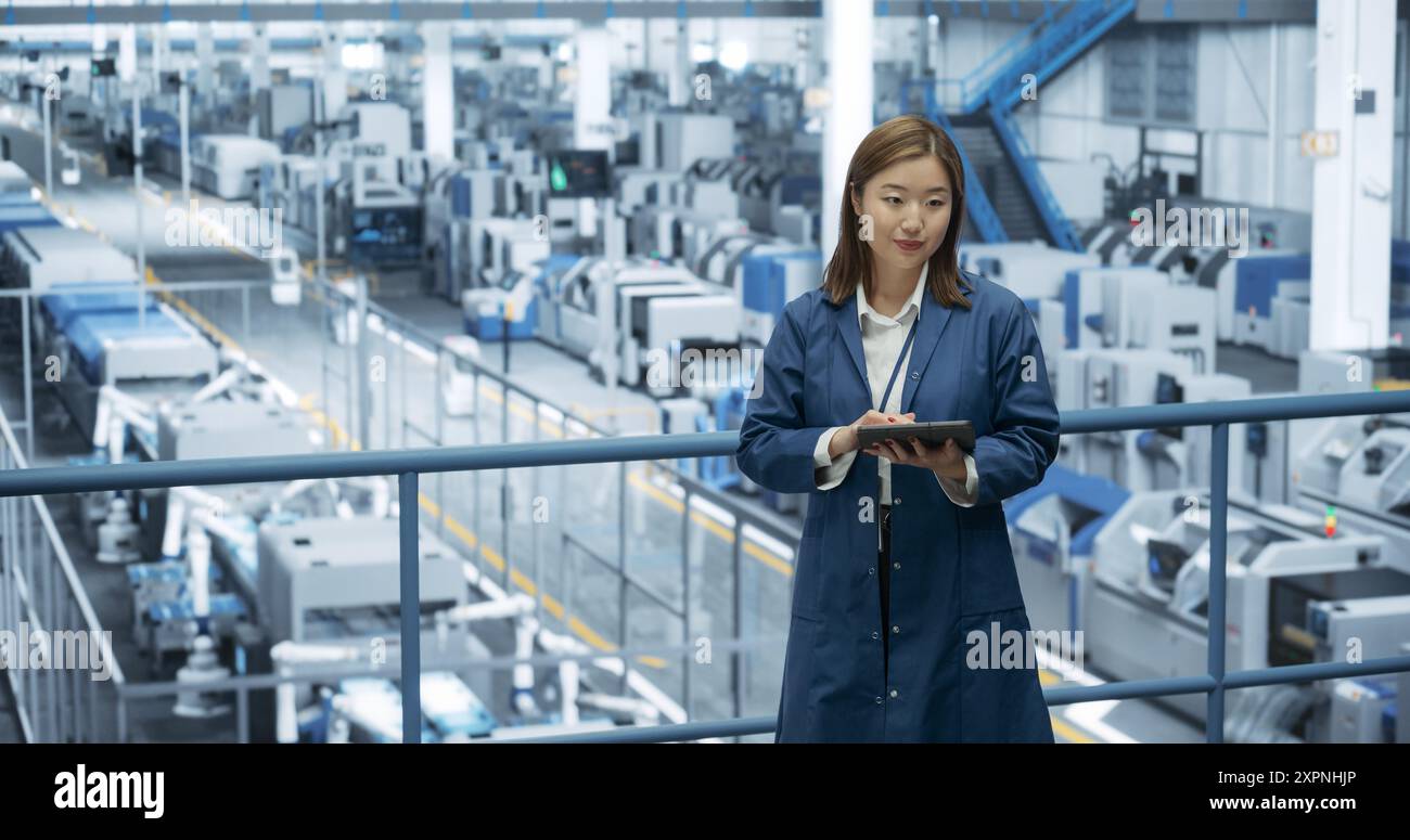 Thoughtful Asian Engineer Monitoring and Analyzing Conditions at a ...