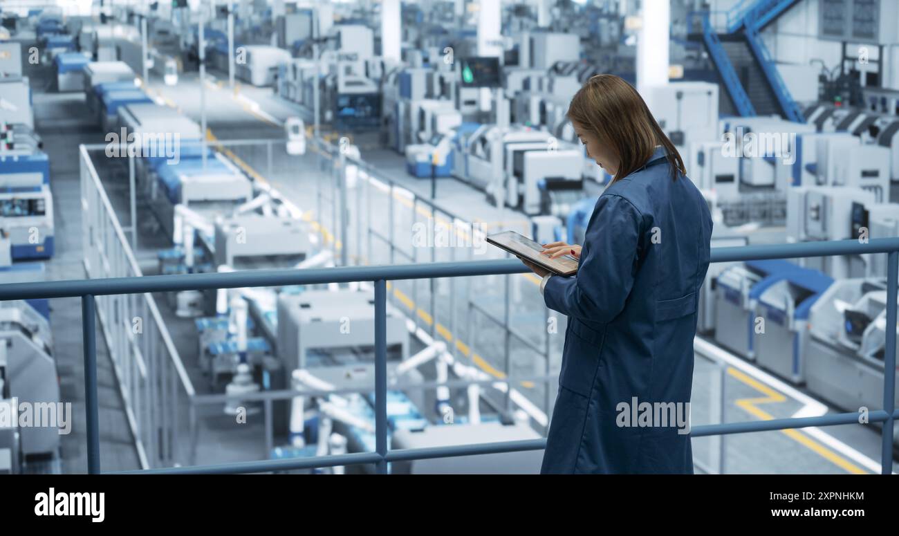 Thoughtful Asian Engineer Monitoring and Analyzing Conditions at a ...