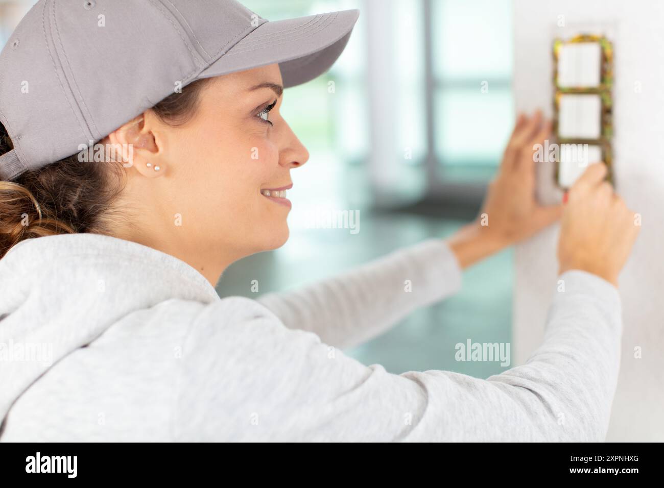 Female builder fixing electricity hi-res stock photography and images ...